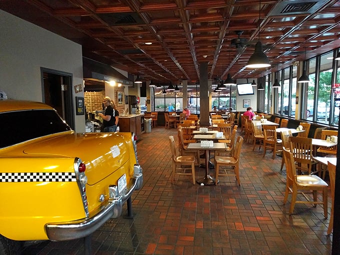 Step inside and be transported! With its yellow cab front and wood-paneled ceiling, AJ's interior is like a love letter to New York, written in cheese and sauce.