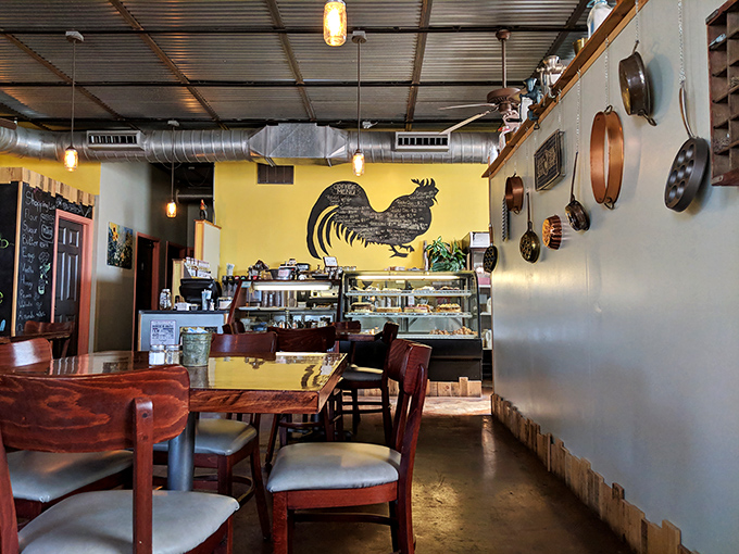 Step into a world where roosters rule and pans hang like culinary constellations. This isn't just a cafe; it's a cozy corner of comfort food heaven.