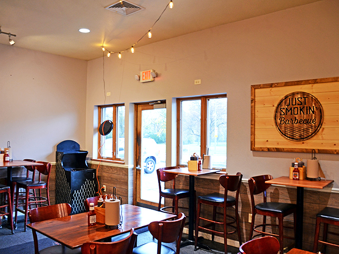 Step inside and feel the warmth! This cozy interior, with its wooden accents and string lights, is like a hug for your soul before the food even arrives.