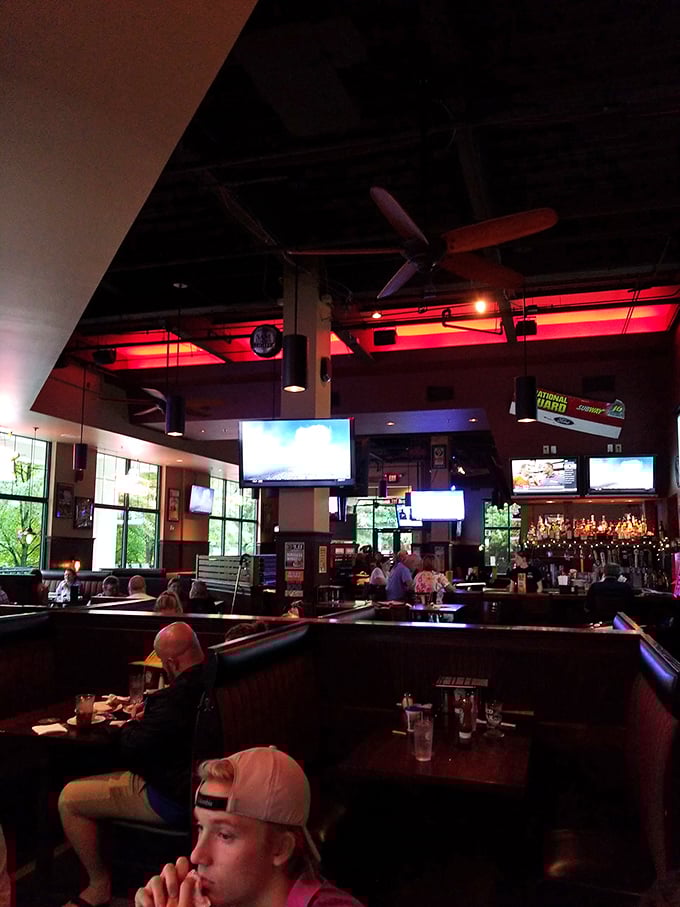 Step inside and feel the warm glow of neon and the promise of comfort food. It's where "Cheers" meets "Wing Night" in the best possible way.