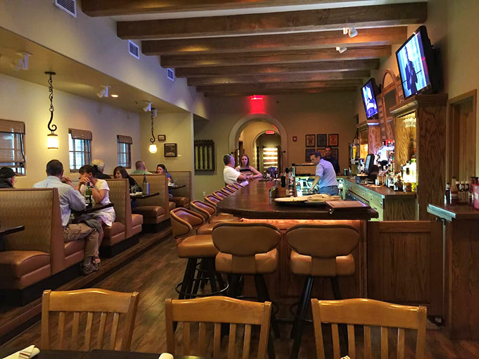 Step inside and feel the warmth embrace you. With its cozy booths and rustic beams, this dining room is like a hug from your favorite aunt &ndash; comforting and full of promise.