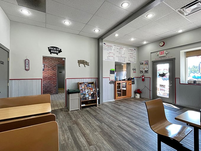 No-frills interior with a purpose&mdash;every ounce of energy goes into the meat, not the d&eacute;cor. That pig silhouette on the wall isn't just decoration, it's a promise.