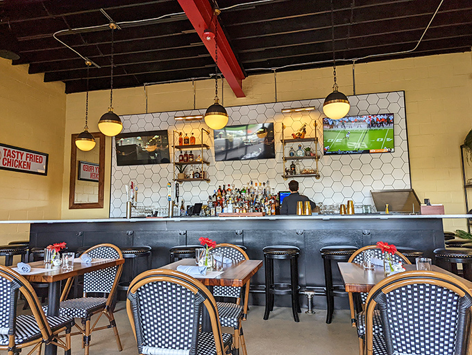 The honeycomb-tiled bar wall isn't just clever branding&mdash;it's the perfect backdrop for serious wing contemplation and cold beer enjoyment.