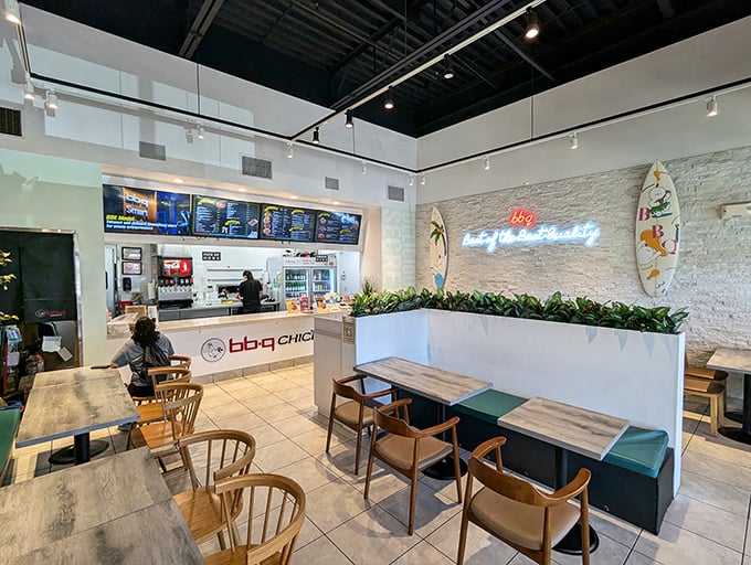 Clean lines, bright spaces, and that neon sign promising "joy & beauty" &ndash; they're not overselling. This minimalist interior lets the food take center stage, as it should.