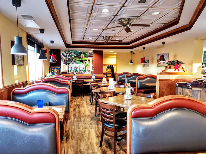 Step into a time machine disguised as a diner. Red and blue booths invite you to slide in and stay awhile, surrounded by the warm glow of classic Americana.