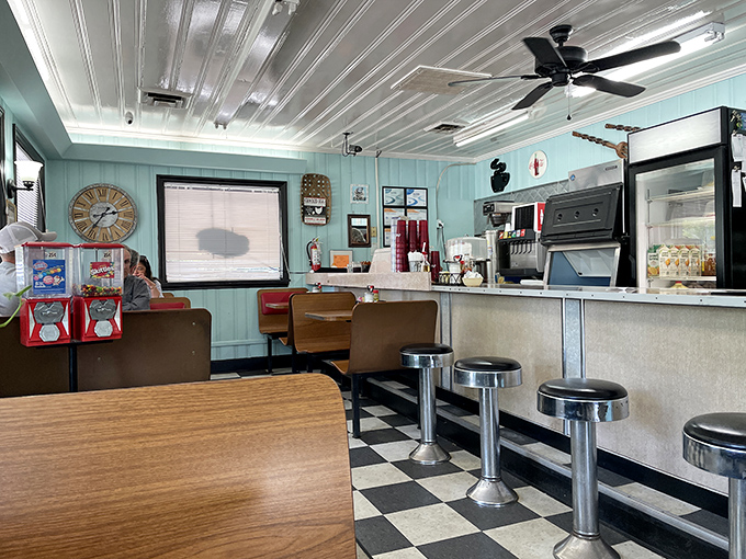 Step into a time machine disguised as a diner. The checkered floor and chrome stools are your ticket to a tasty trip down memory lane.