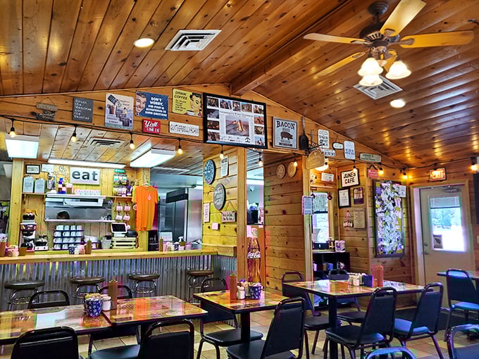 Wooden walls adorned with memorabilia tell stories while the "EAT" sign offers the simplest, most perfect command you'll gladly follow at June's Cafe.