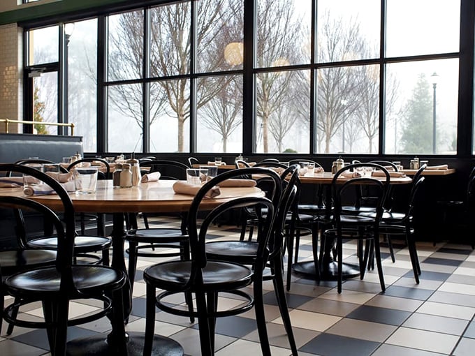 Step into a time machine of taste. This retro-chic interior whispers "Mad Men" but shouts "Let's eat!"