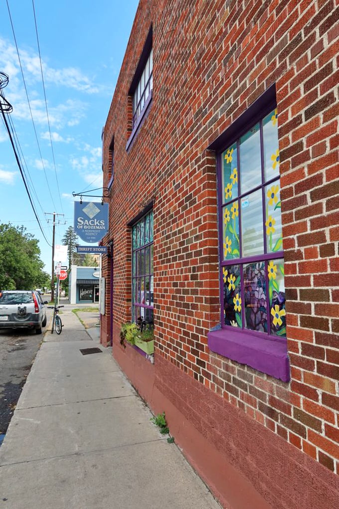 Flower power meets thrift store chic. This window display is more colorful than a 1960s acid trip, minus the hallucinations.