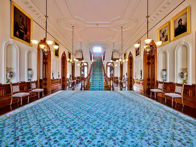 Talk about a grand entrance! This hallway screams "royalty" louder than a peacock in a tuxedo.
