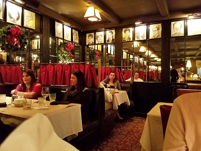 Step into a time capsule of cozy elegance. Red booths, warm lighting, and celebrity sketches create an atmosphere that's part Rat Pack, part family reunion.