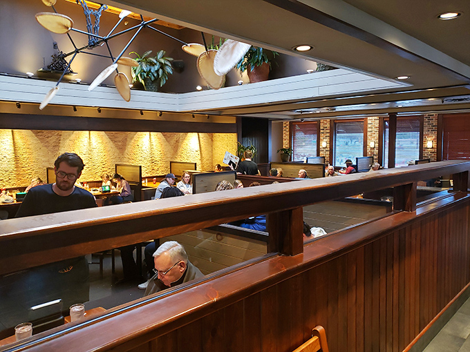 Inside, warm wood tones and thoughtful lighting create that rare atmosphere where you can actually hear your dinner companions while eyeing everyone else's food.