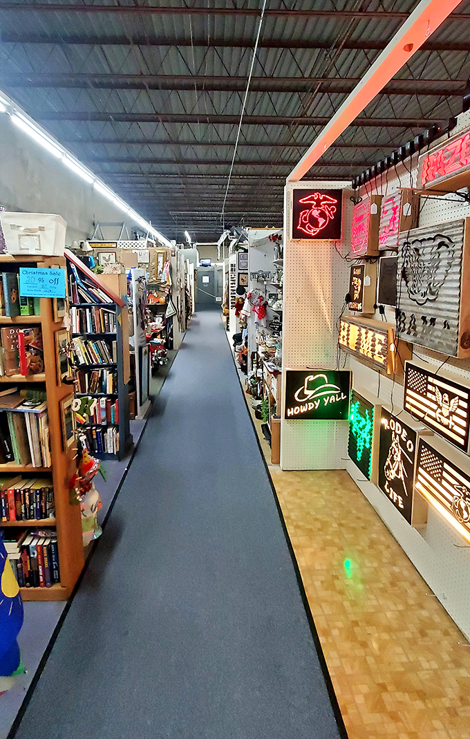 Neon dreams and literary treasures line these aisles. That "Howdy Y'all" sign isn't just decoration&mdash;it's practically the Arkansas state greeting.