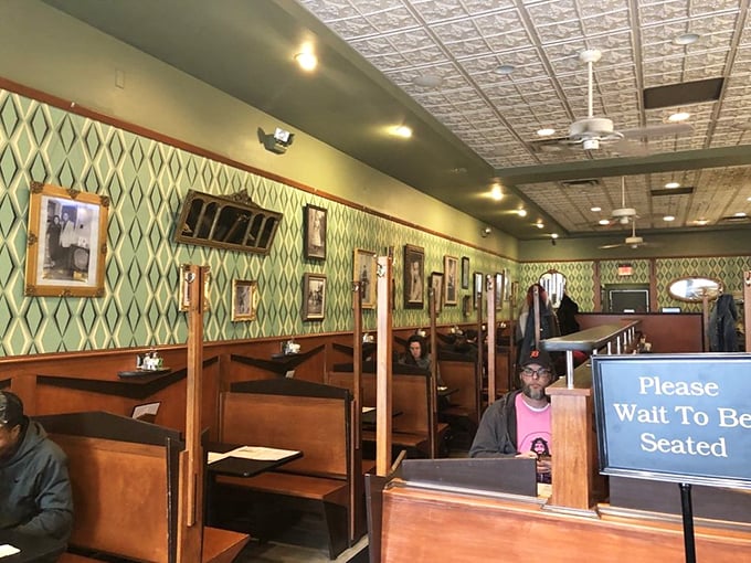 Wooden booths and diamond-patterned wallpaper create the perfect backdrop for serious sandwich contemplation &ndash; nostalgia you can actually taste.