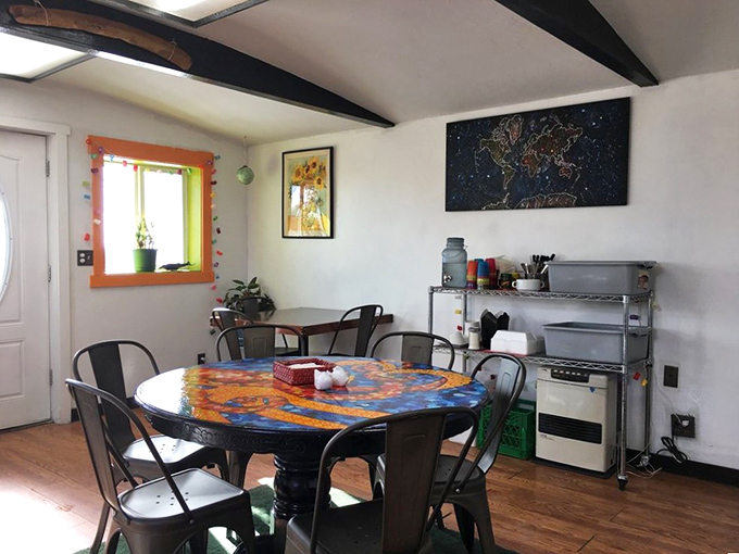 Step into a world where mismatched chairs and vibrant art collide. It's like your eccentric aunt's living room, but with better food and fewer cat photos.