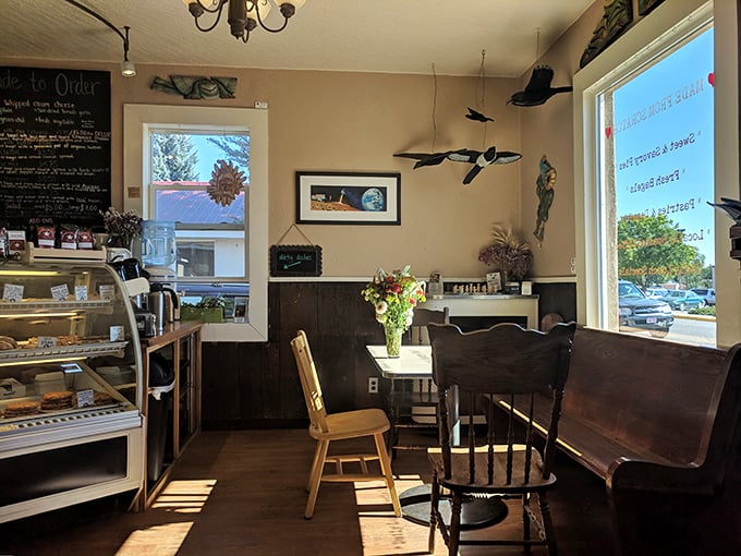 Step inside and feel the warmth! This cozy interior, with its mismatched chairs and quirky decor, is like your cool aunt's kitchen &ndash; if she were a pie genius.