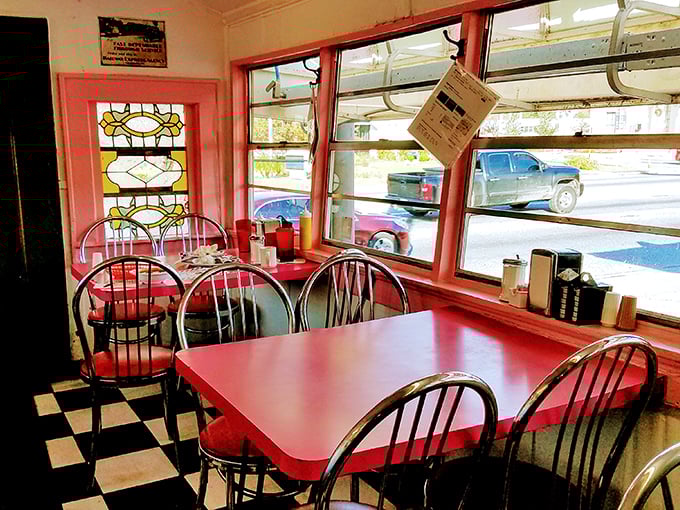 Slide into a slice of Americana! The interior of Angel's is a cherry-red symphony of nostalgia, complete with gleaming chrome and a stained-glass window that screams "Norman Rockwell was here."