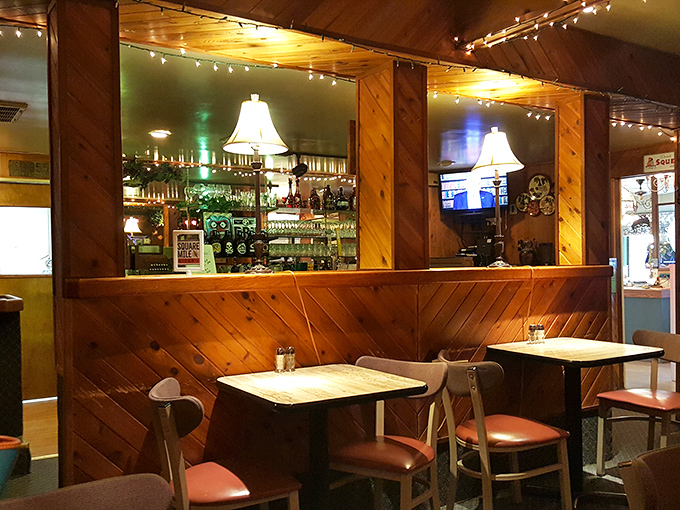 Step into a cozy time capsule of comfort. The warm wood paneling and twinkling lights create an atmosphere that's as inviting as grandma's living room.