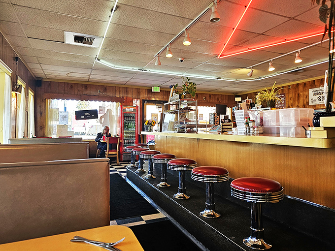 Step into a time machine disguised as a diner! Red vinyl booths and chrome stools transport you to an era when conversation flowed as freely as the coffee.