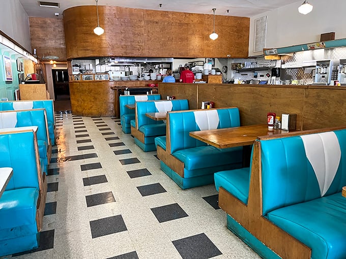 Welcome to the land of turquoise dreams and checkered floors. This isn't just a diner; it's a portal to simpler times and bigger appetites.