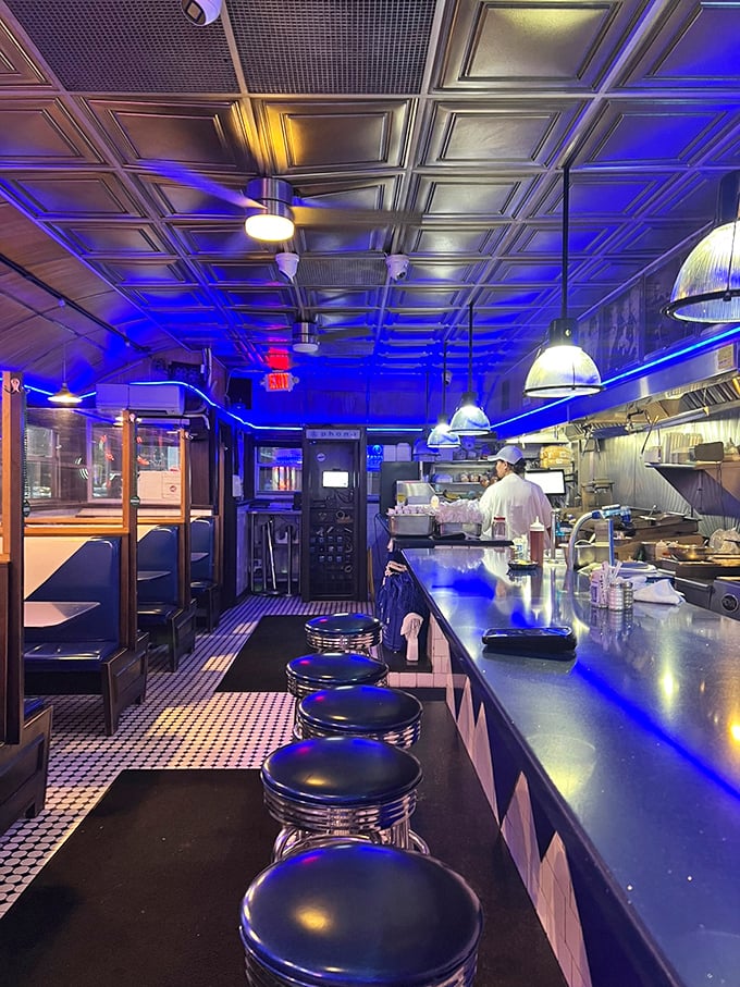 Step into a time machine disguised as a diner. The blue glow isn't just lighting; it's a portal to simpler times.