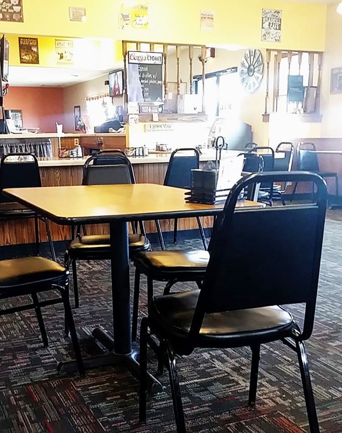 Step into a time machine of taste! This cozy interior whispers tales of countless satisfying meals and friendly conversations shared over steaming cups of joe.