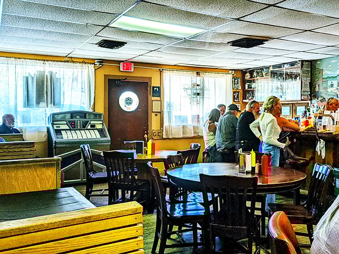 Welcome to burger paradise! This cozy interior whispers tales of satisfied patrons and sizzling patties that have kept folks coming back for decades.
