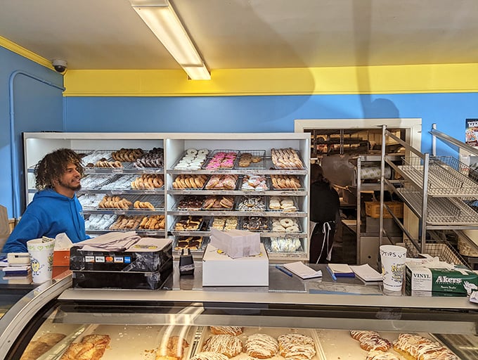 Behold the promised land of pastries! This display case is like a museum of edible art, each shelf a gallery of glazed masterpieces.