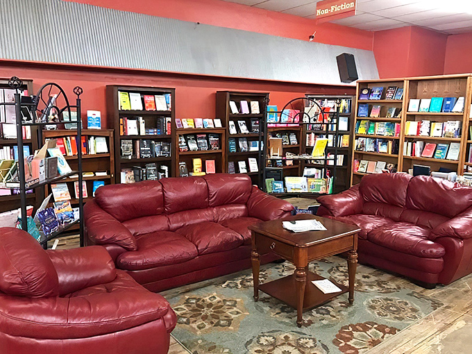 Cozy up in bookworm heaven! Plush red leather couches invite you to sink in and lose yourself in a good story.