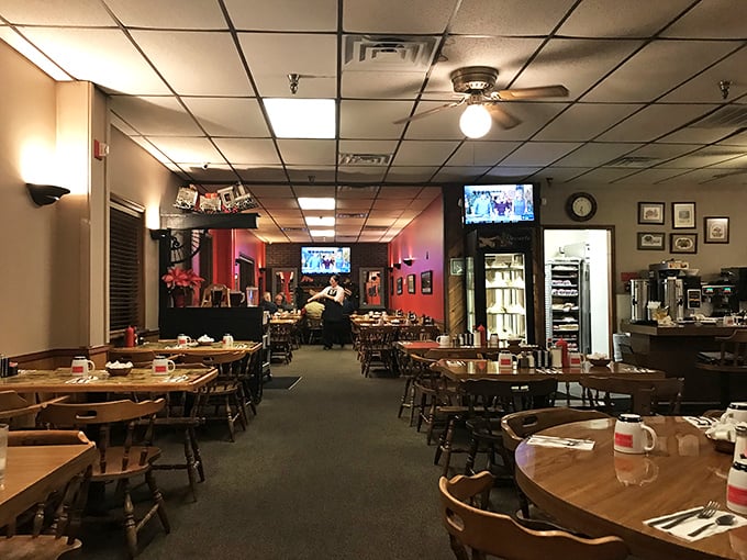 Step inside and you're transported to a cozy diner wonderland, complete with pink walls and TVs for your viewing pleasure.