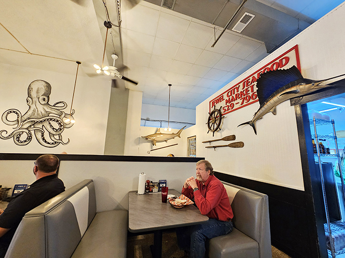 Dive into a sea of charm! The whimsical octopus art and nautical decor set the stage for a fin-tastic dining adventure.