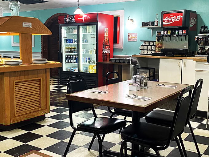 Step into a time capsule of culinary nostalgia. This checkered floor has seen more stories unfold than a soap opera marathon.