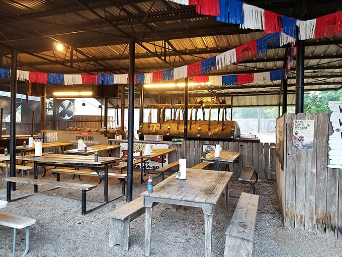 Rustic charm meets meat lover's dream. This dining area could double as a set for a country music video about smoky, savory bliss.