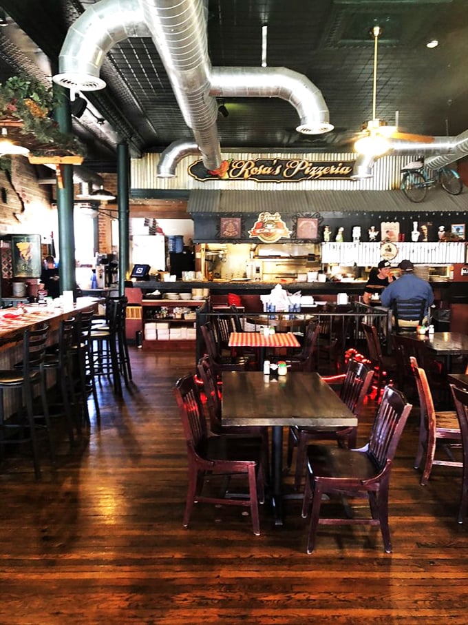 Step into Rosa's, where industrial chic meets cozy trattoria. The exposed ductwork whispers sweet nothings to the rustic wooden tables below.