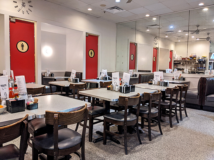 Step into a time warp of terrific taste! The Majestic's interior is a symphony of red doors, gleaming surfaces, and the promise of comfort food classics.