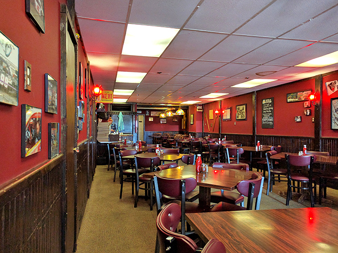 Step into a time capsule of flavor. This cozy interior, with its red walls and wooden booths, whispers tales of countless pizza pilgrimages.