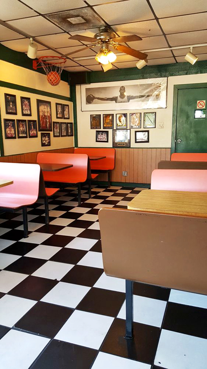 Step into a time machine of taste! This retro interior is where buffalo sauce dreams and checkered floor memories are made.