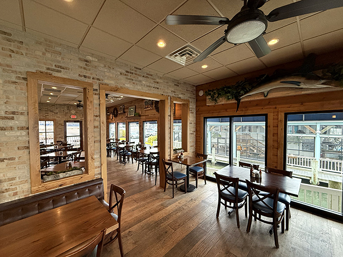 Step inside and you're greeted by a maritime hug. Exposed brick, wooden beams, and large windows create a cozy atmosphere that's part ship's cabin, part beachside retreat.
