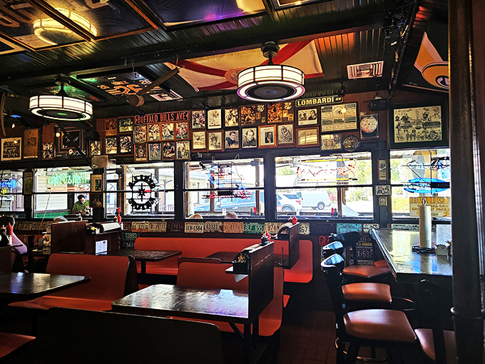 Sports memorabilia covers every inch of wall space, creating the kind of authentic atmosphere that corporate chains spend millions trying to replicate and never quite manage.