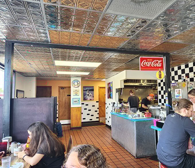 Inside, the pressed tin ceiling and classic diner counter create the perfect backdrop for breakfast magic. No interior designer needed&mdash;just decades of satisfied customers and sizzling griddles.