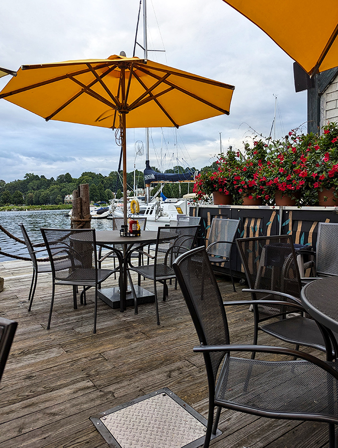 Who needs a cruise when you've got this view? Sunny umbrellas and lakeside tables set the stage for a perfect meal.