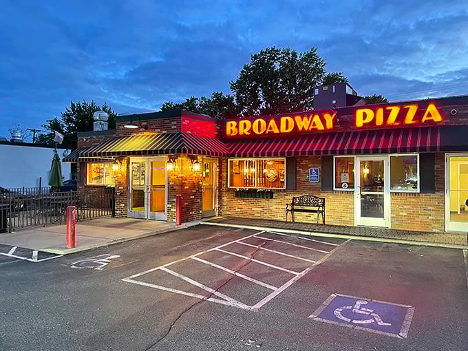 Broadway Pizza's retro charm: This neon beacon guides pizza lovers home. It's been lighting up taste buds longer than I've had gray hair!