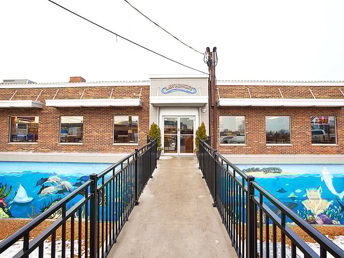 Lawrence's Fish & Shrimp: The late-night hero we deserve! That giant shrimp sign isn't compensating &ndash; it's a promise of colossal flavor.