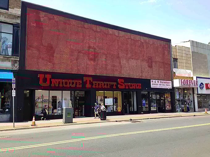 Unique by name, unique by nature! This thrift store's bold red sign beckons bargain hunters like a siren call to savvy shoppers.