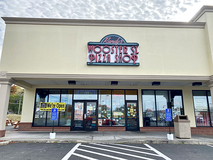 Randy's Wooster Street Pizza: A neon beacon of hope for hungry souls. This retro sign promises pizza paradise awaits inside.