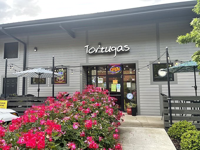 Blooming with potential! Tortugas serves up pizzas as colorful and inviting as its flower-adorned entrance.