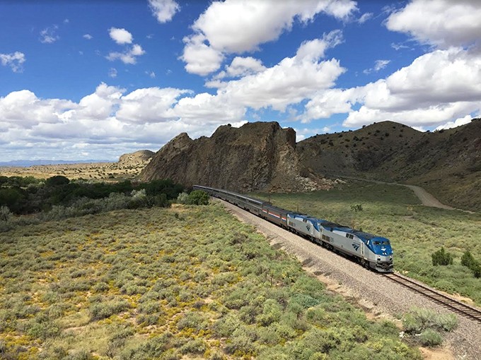 All aboard the time-travel express! This train's not just crossing landscapes; it's bridging centuries of New Mexican history.