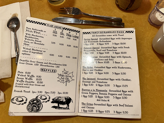 Forget smartphone apps, this hand-written menu is the original 'scroll' of breakfast wisdom. Pancakes or waffles? The struggle is real!