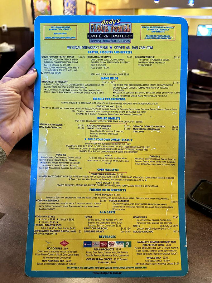 Behold, the menu of dreams! This blue board holds more treasures than Indiana Jones could shake a fork at. Choose wisely, adventurer.