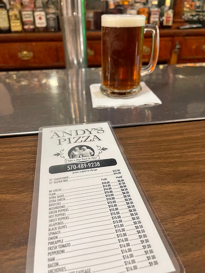 Decisions, decisions! Andy's menu is a treasure map of cheesy delights. X marks the spot for your next favorite slice.